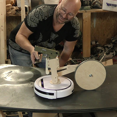 Joerg Sprave Hacks a Robot Vacuum So That It Can Carry and Fire a Glock ...