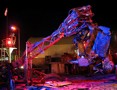 Giant robotic hand crushes cars for scrap, heads for scrapyard - Core77